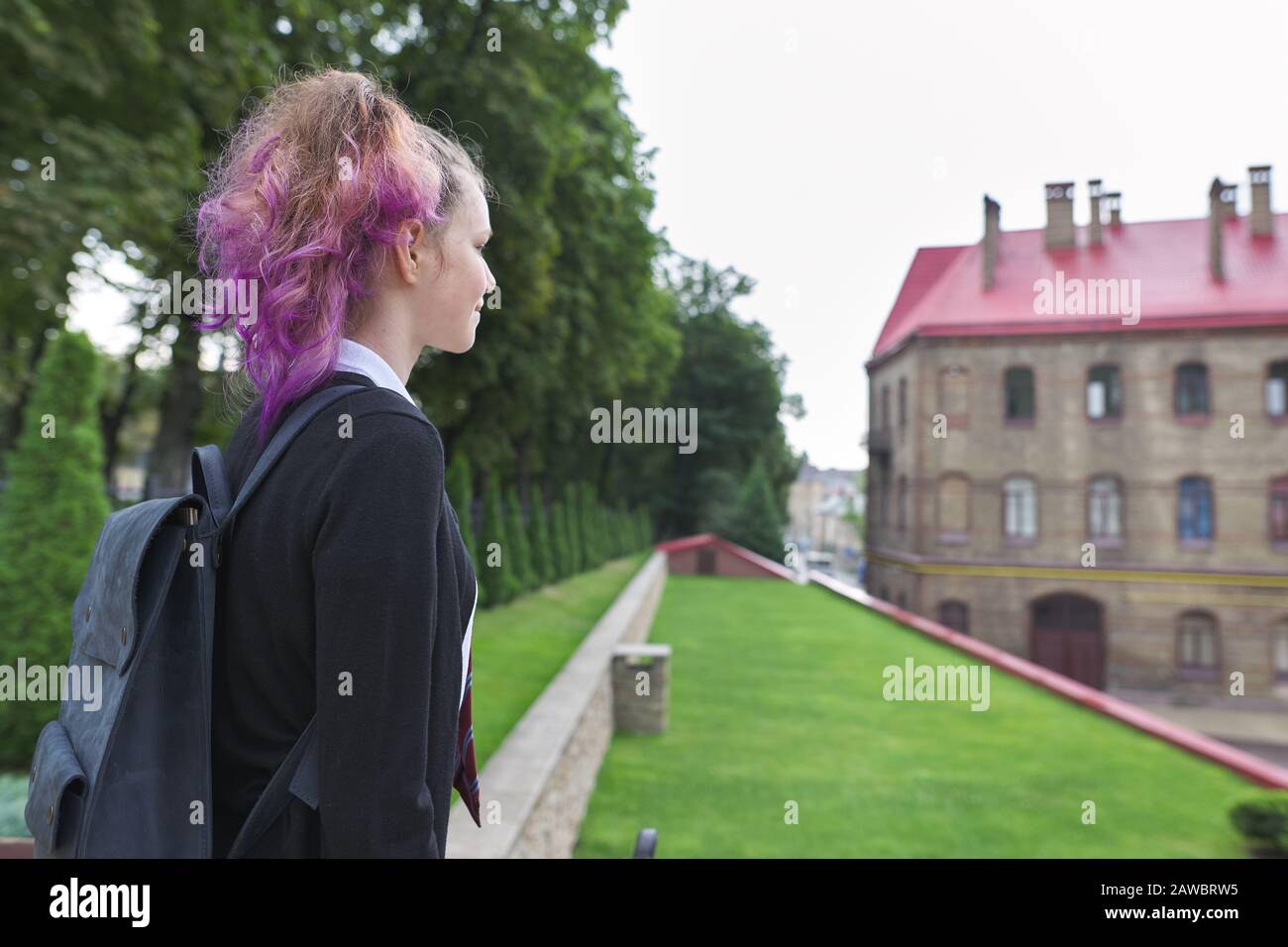Outdoor teenager girl student with backpack in school uniform Stock ...