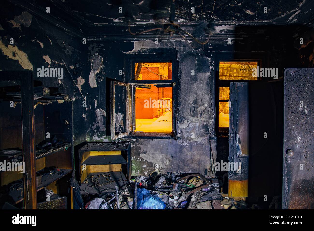 Burnt house interior. Burned furniture, charred walls and ceiling in ...