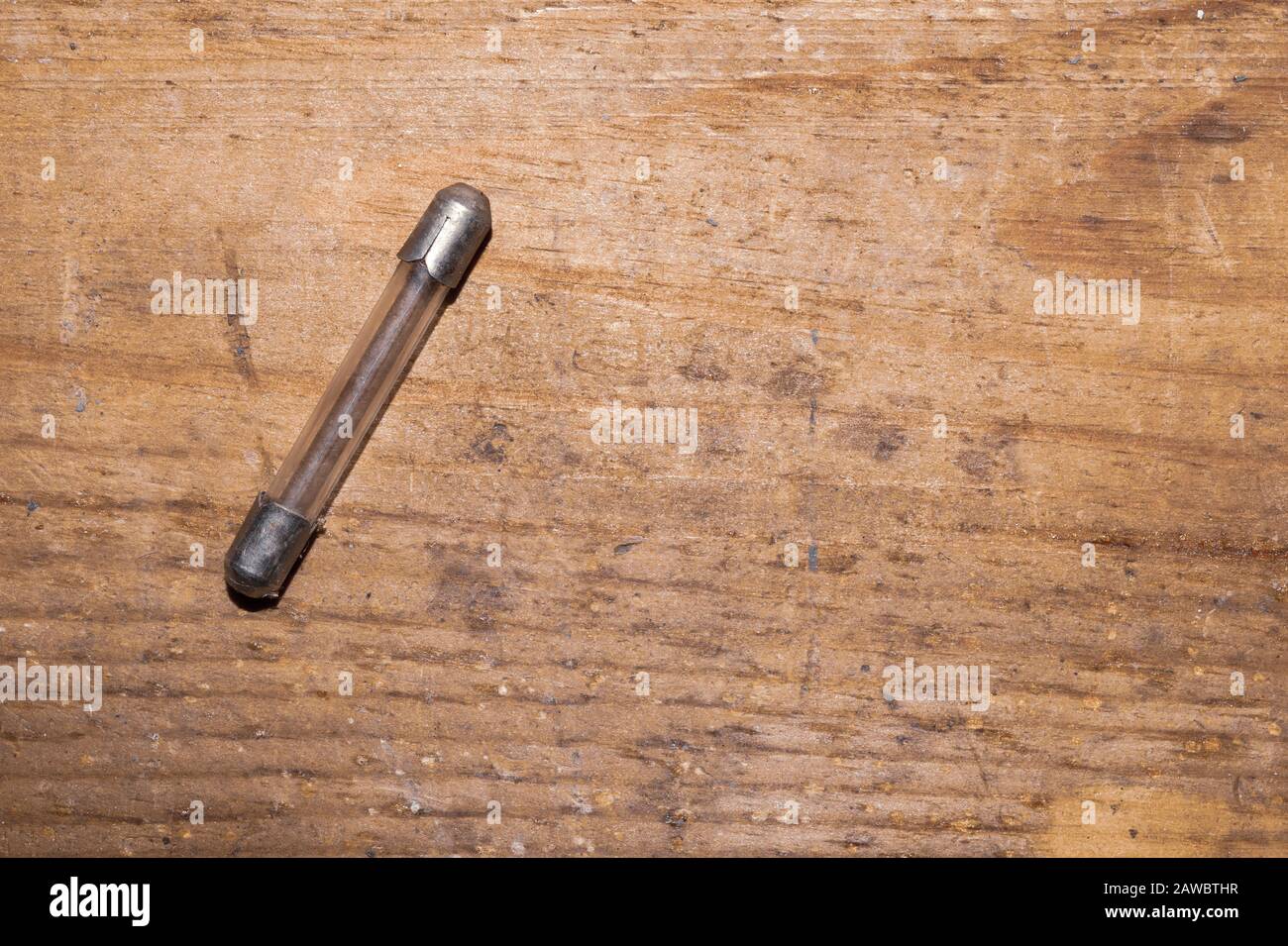 Fuse on wooden background. safety device for overcurrent protection ...