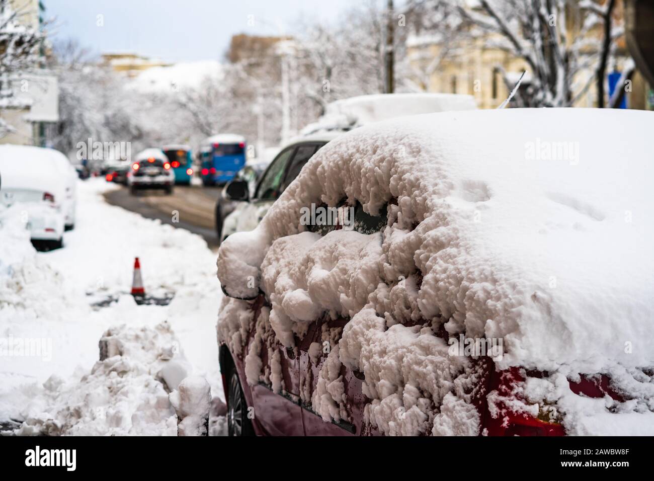 Cars covered with snow from the first snow fall of the year. Winter ...