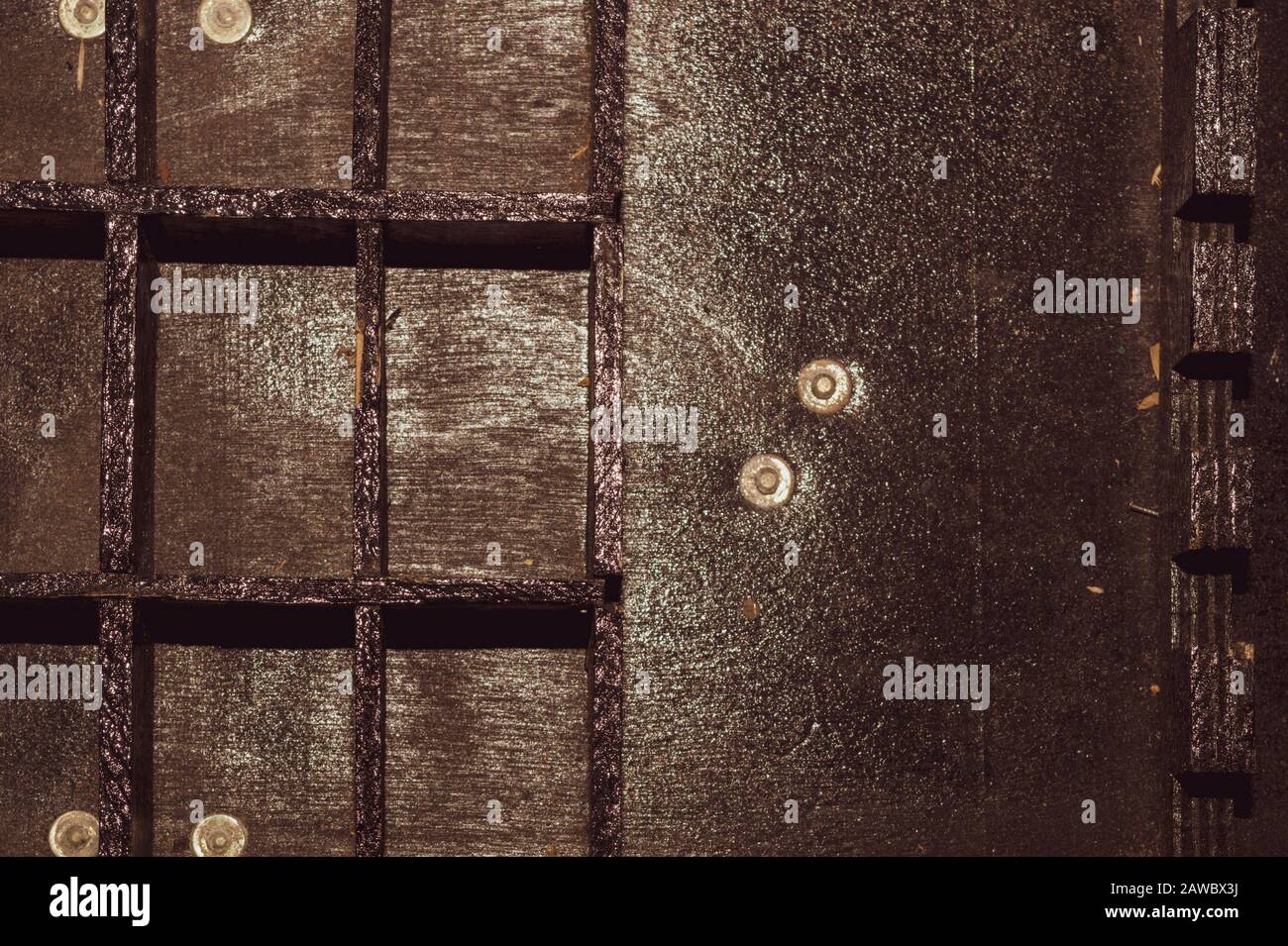 Old wooden box with cells. shelves in a black wooden rack. empty ...