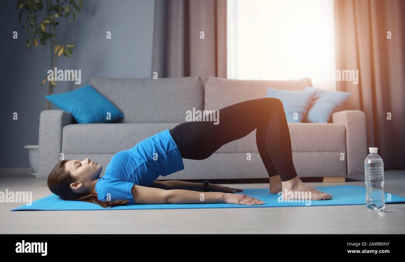 Lady doing bridge yoga pose Stock Photo - Alamy