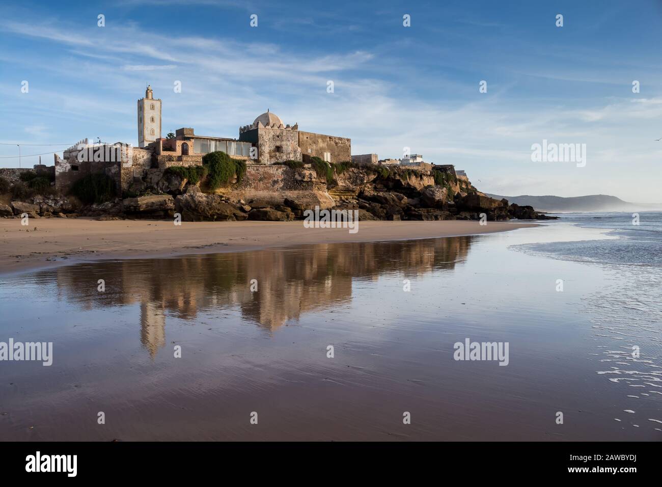 Small mosque with a traditional tower, on a rock above the Atlantic ...