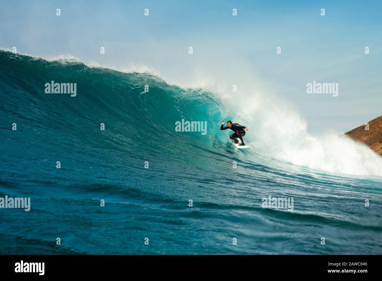 Surfer riding waves on the island of fuerteventura Stock Photo - Alamy