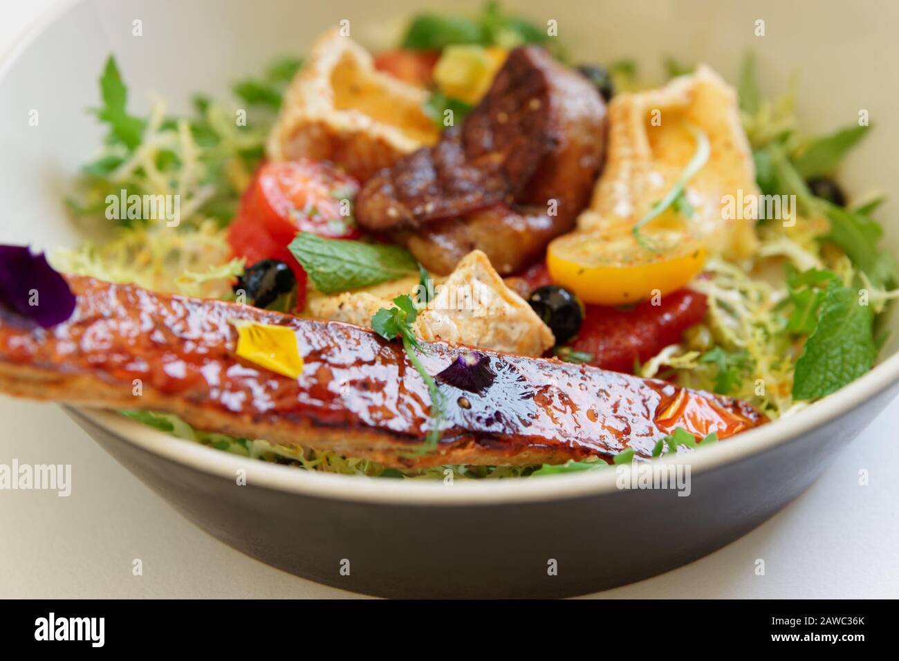 French starter of duck liver, camembert and lettuce Stock Photo - Alamy