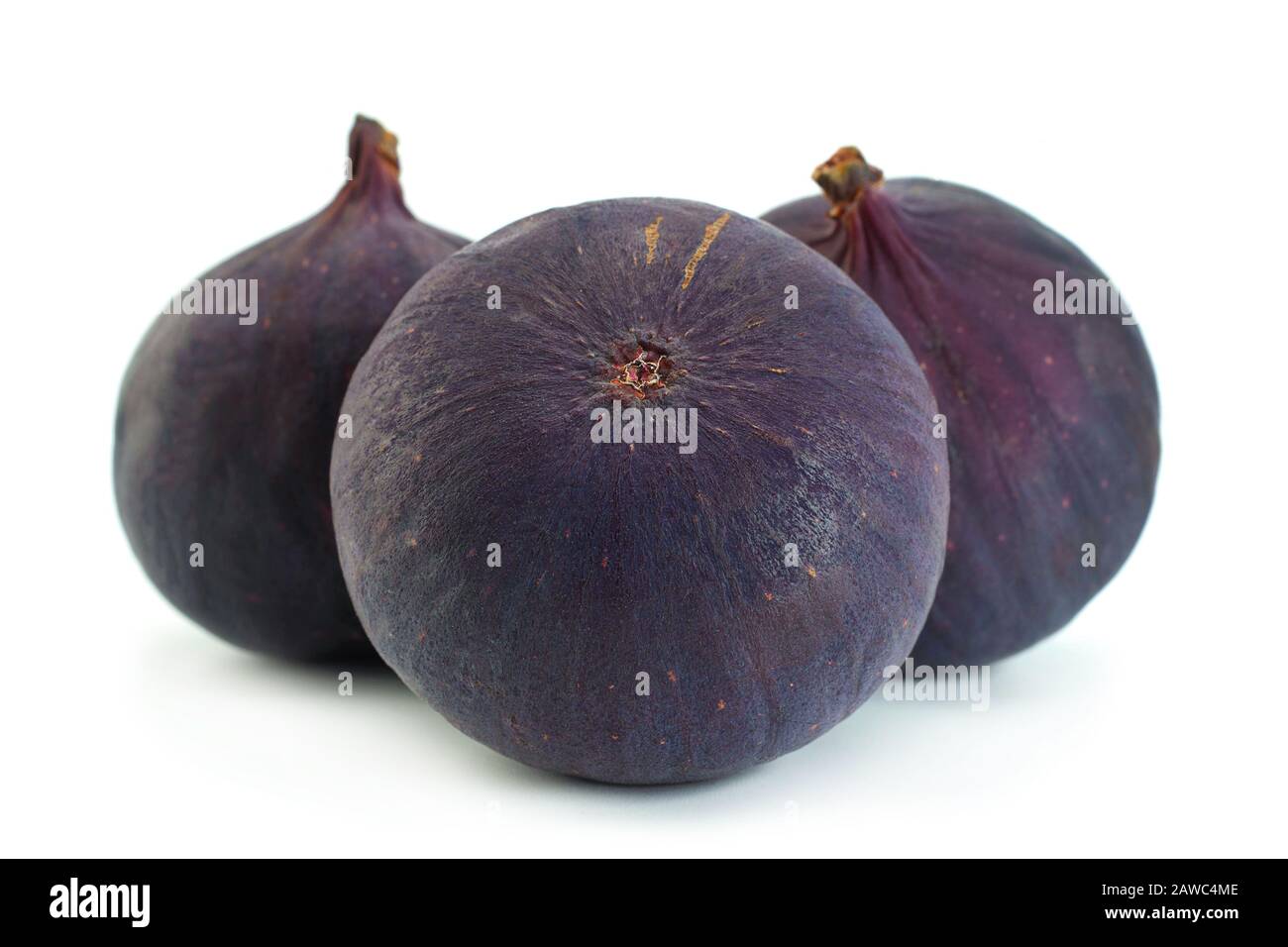 Purple fig fruit closeup isolated on white background Stock Photo - Alamy