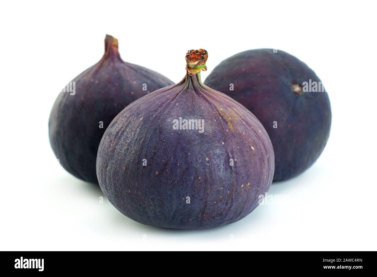 Purple fig fruit closeup isolated on white background Stock Photo - Alamy