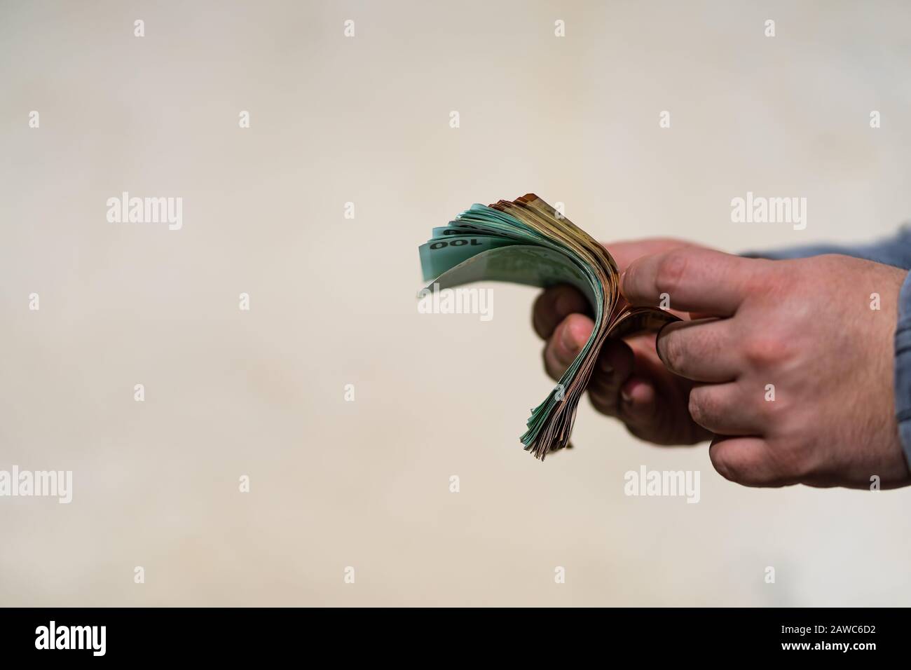 Man hand counting money for a bribe or tips. Holding EURO banknotes on ...