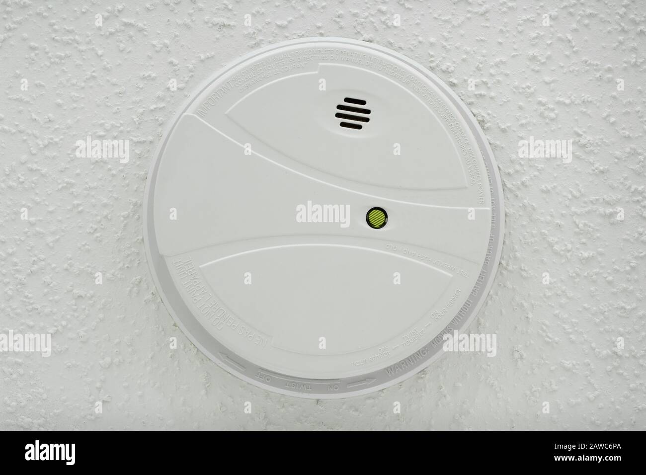 Smoke detector on white ceiling Stock Photo - Alamy