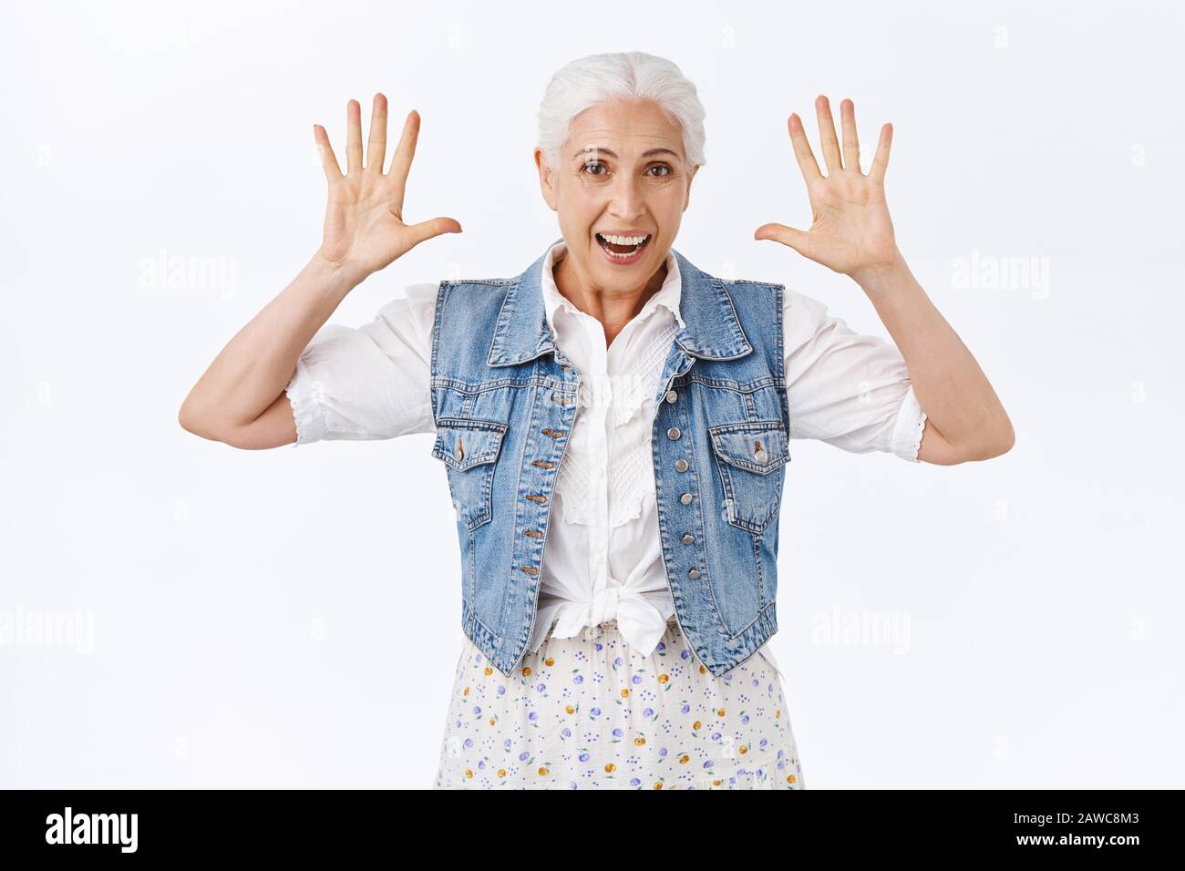 Happy, enthusiastic good-looking senior lady with grey hair, wear ...