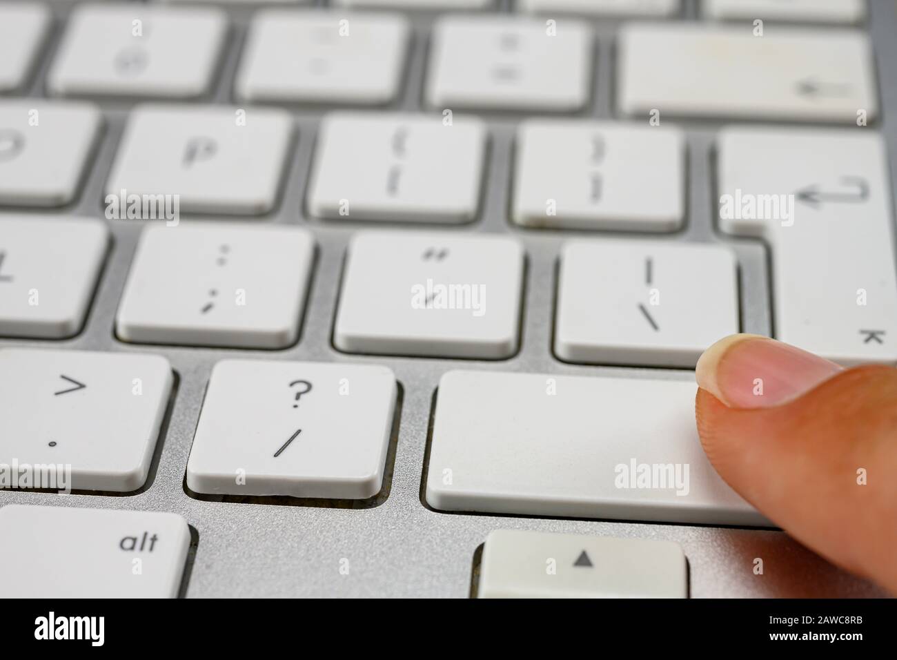 Finger pressing the shift key on keyboard Stock Photo - Alamy