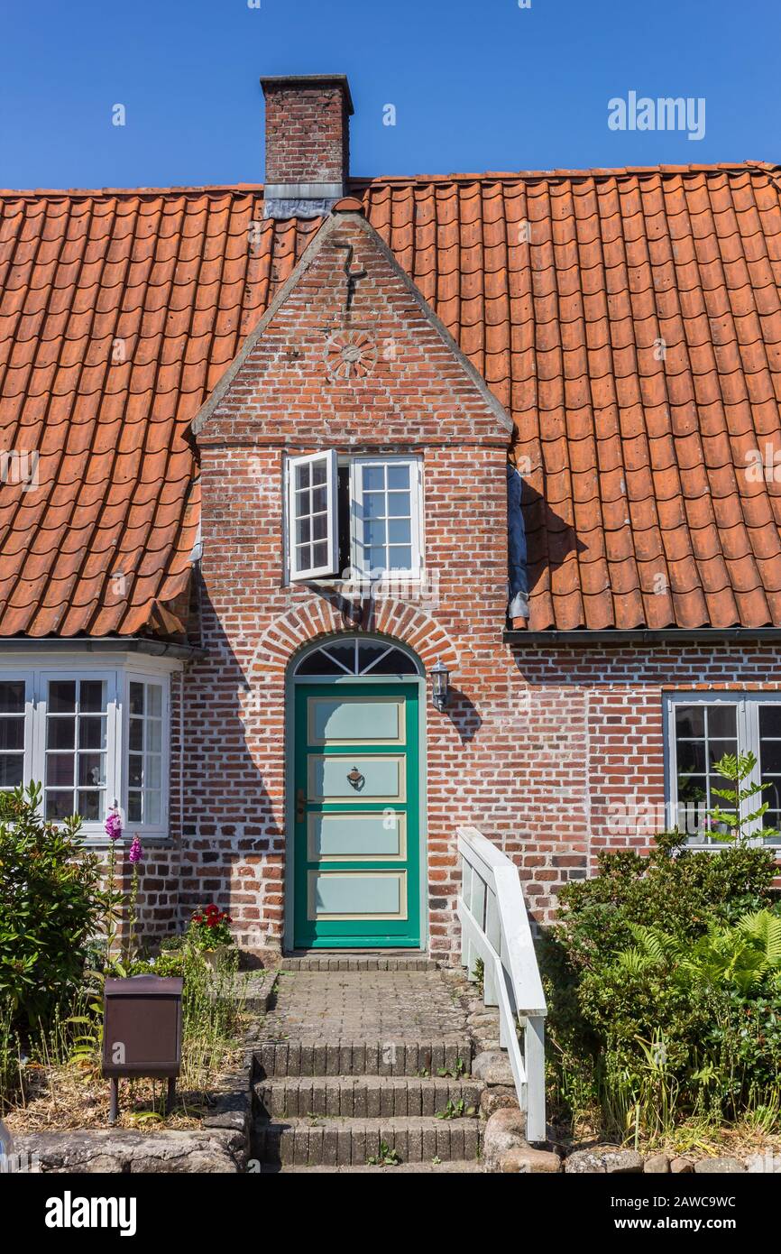 Facade of a traditional red brick house in Mogeltonder, Denmark Stock ...