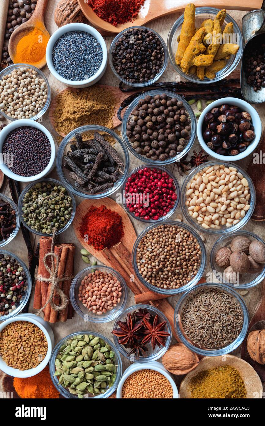 Spices and herbs flat lay, wood table background, top view. Cooking ...