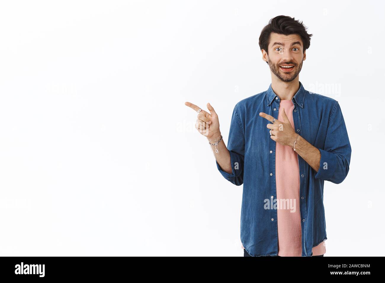 Handsome cheerful, friendly-looking smiling guy inviting you for drink ...
