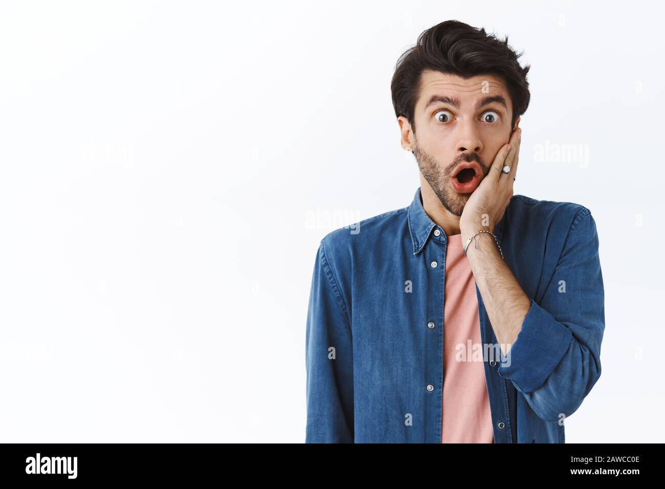 Shocked, speechless young handsome man with beard, gasping drop jaw and ...