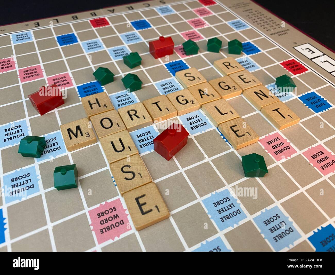 Spelling out words with scrabble tiles hi-res stock photography and ...