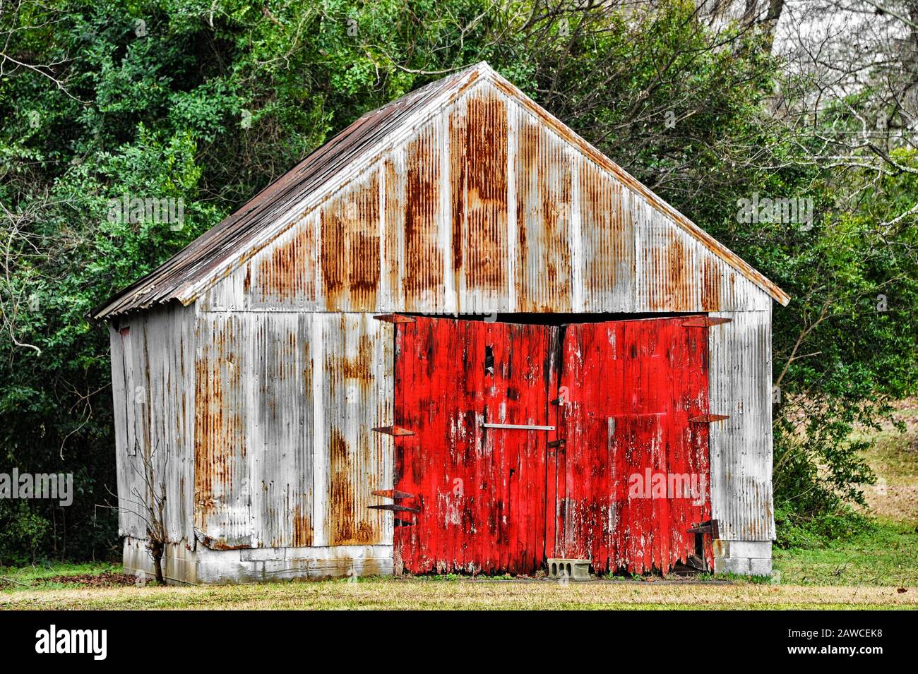 Old Garage Building with Weathered Red Doors Stock Photo - Alamy