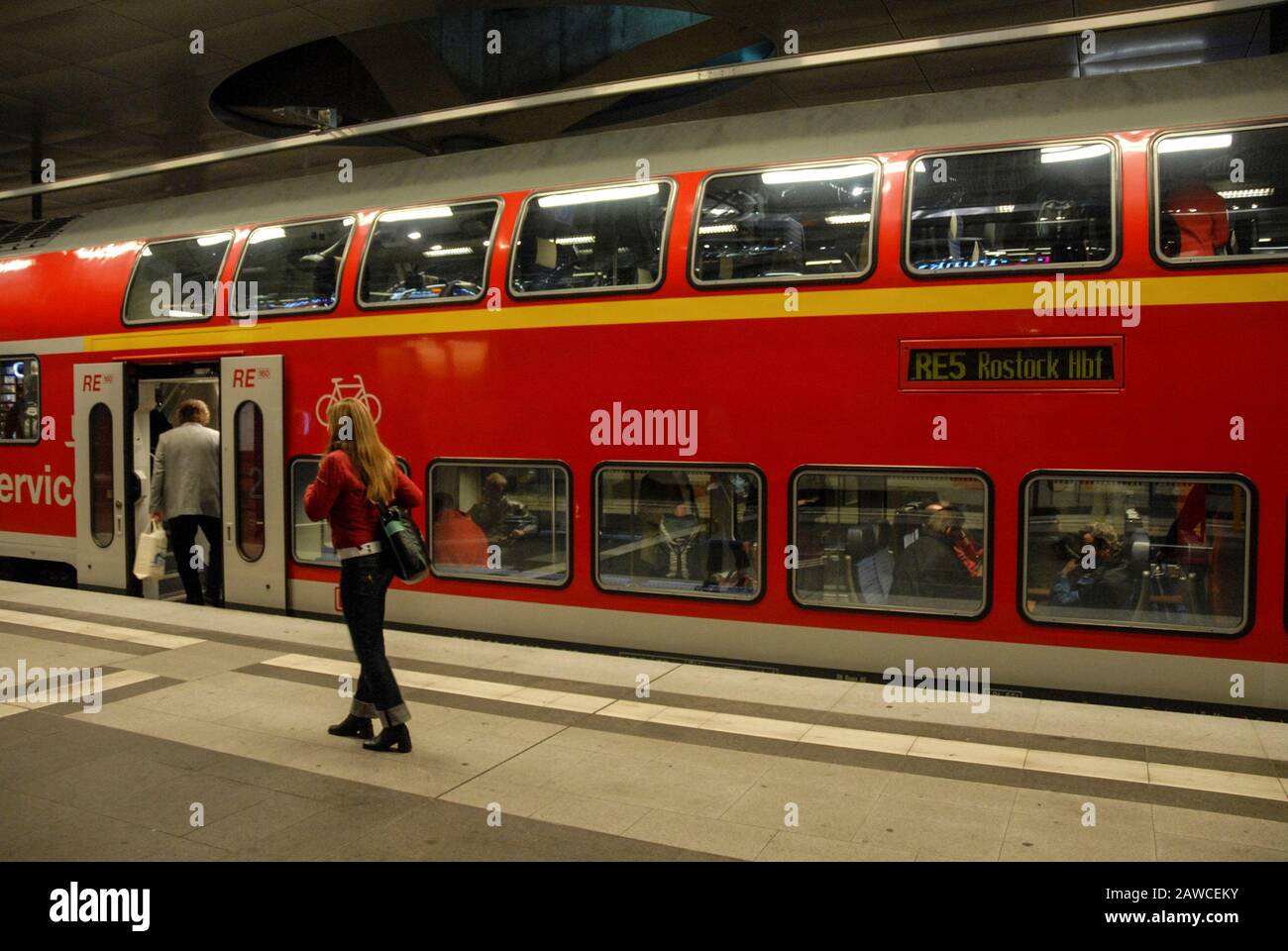 A regional double-decker passenger train at the Berlin rail station ...