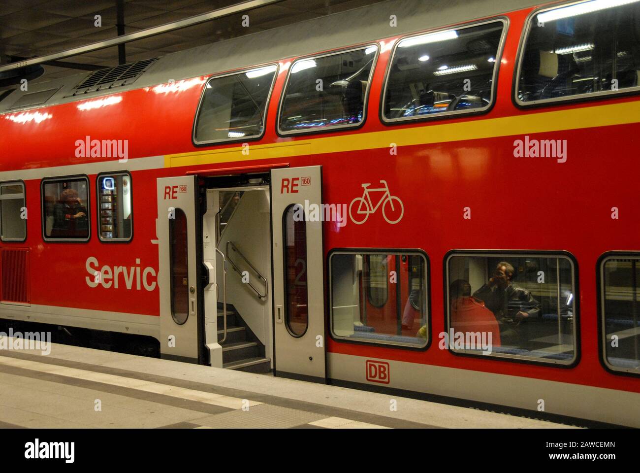 A regional double-decker passenger train at the Berlin rail station ...
