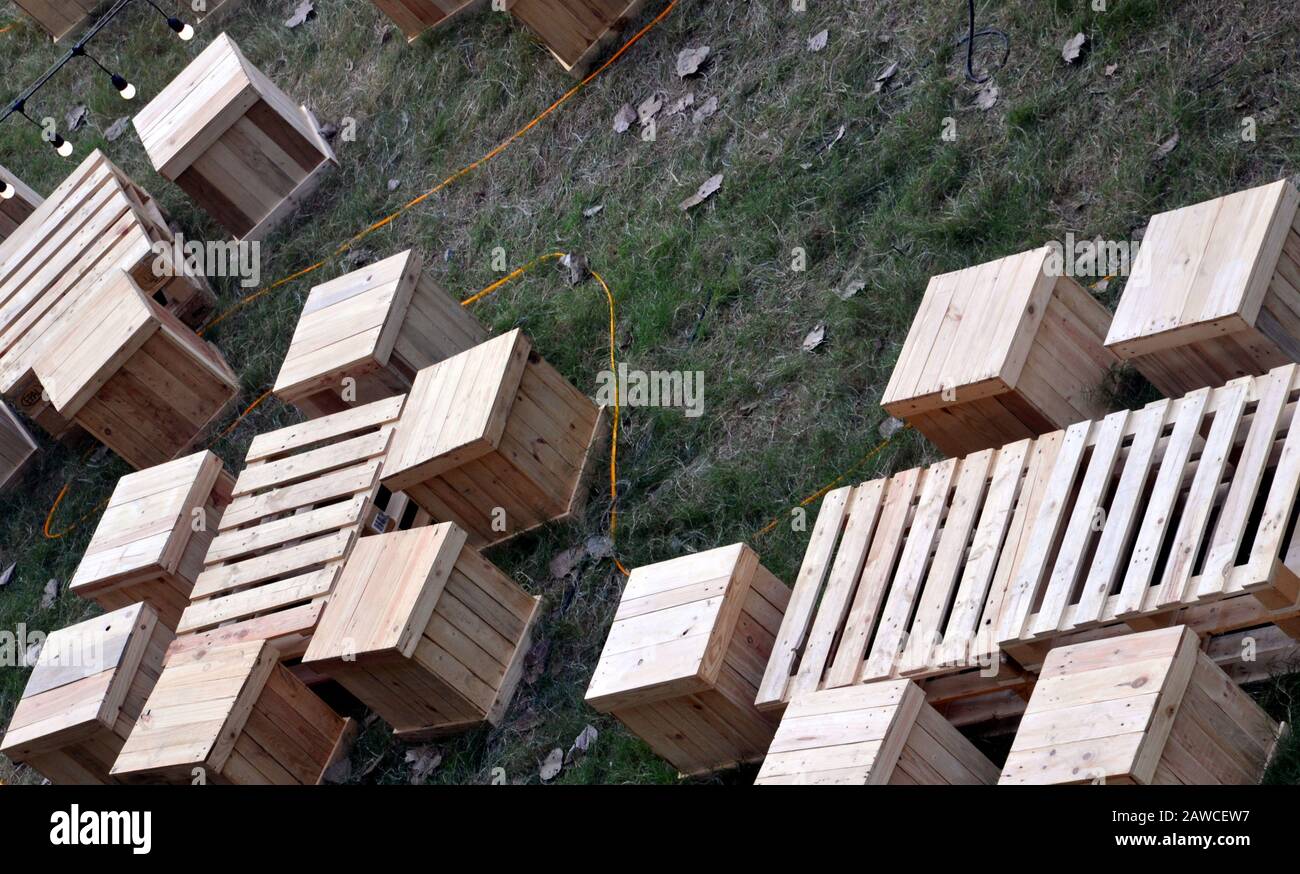 An overhead view of simply made wooden tables and seats at an outdoor ...