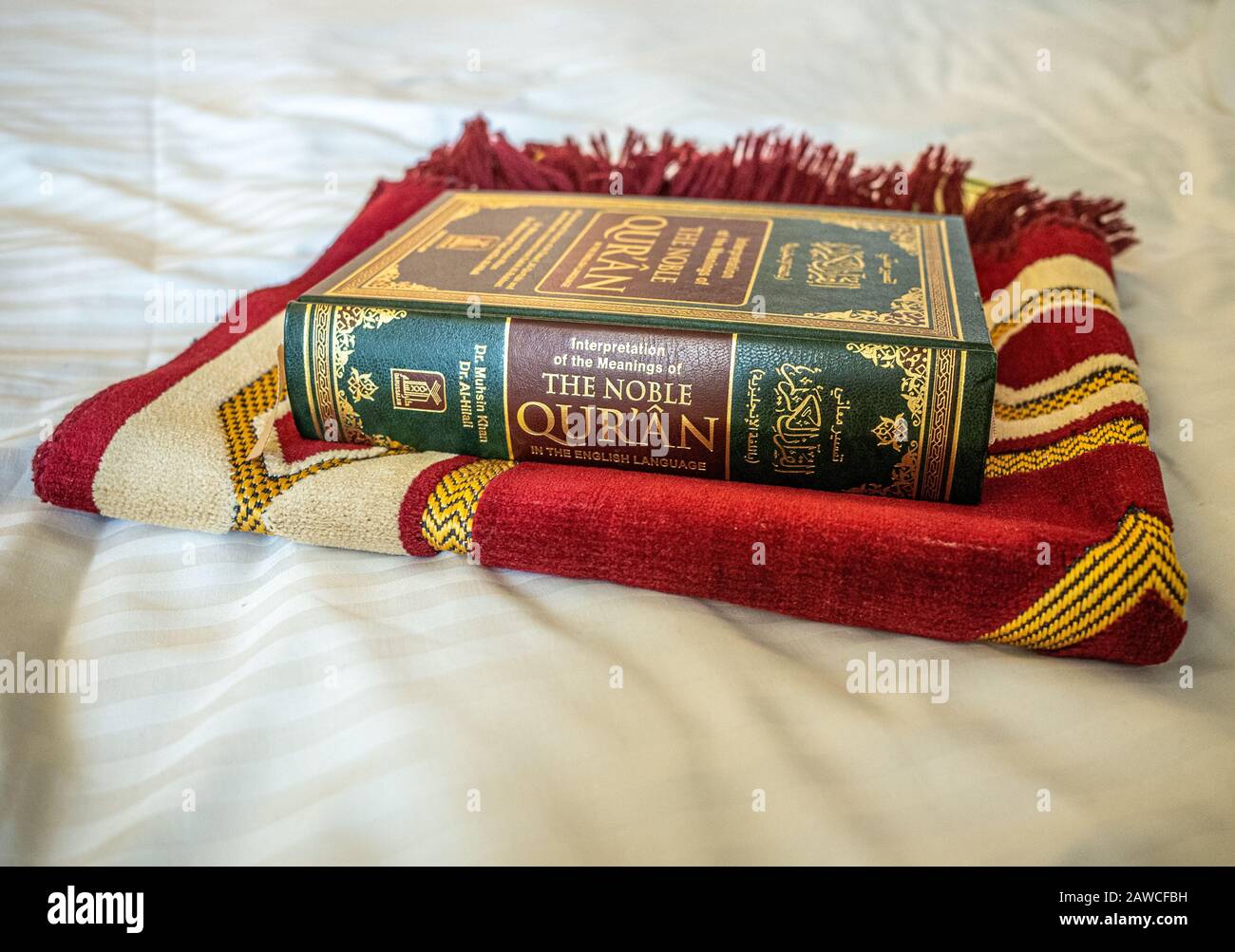 Hotel Room Quran and prayer mat Stock Photo - Alamy