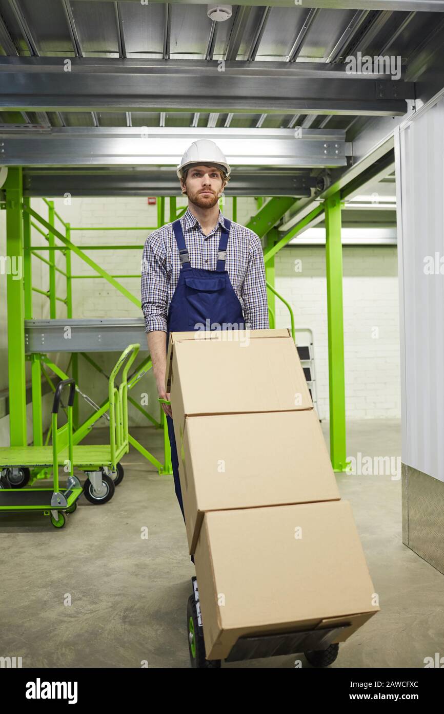 Portrait factory carrying cardboard boxes hi-res stock photography and ...