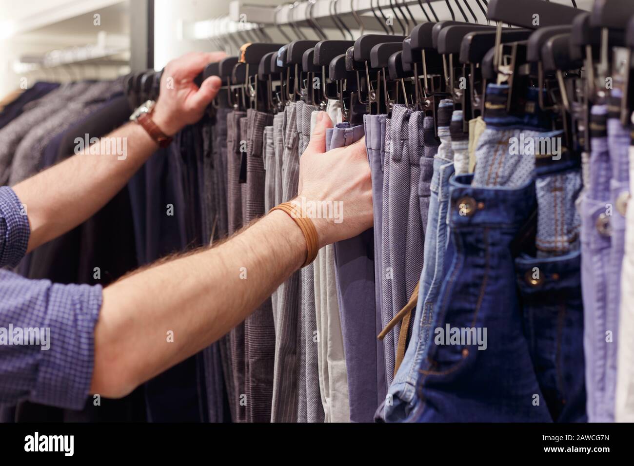 Clothes rack man shopping hi-res stock photography and images - Alamy