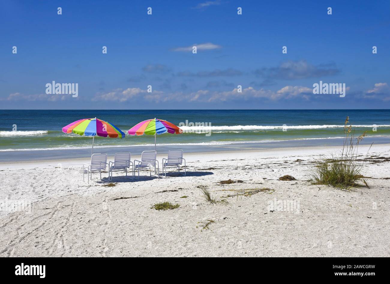 Four chairs beach hi-res stock photography and images - Alamy