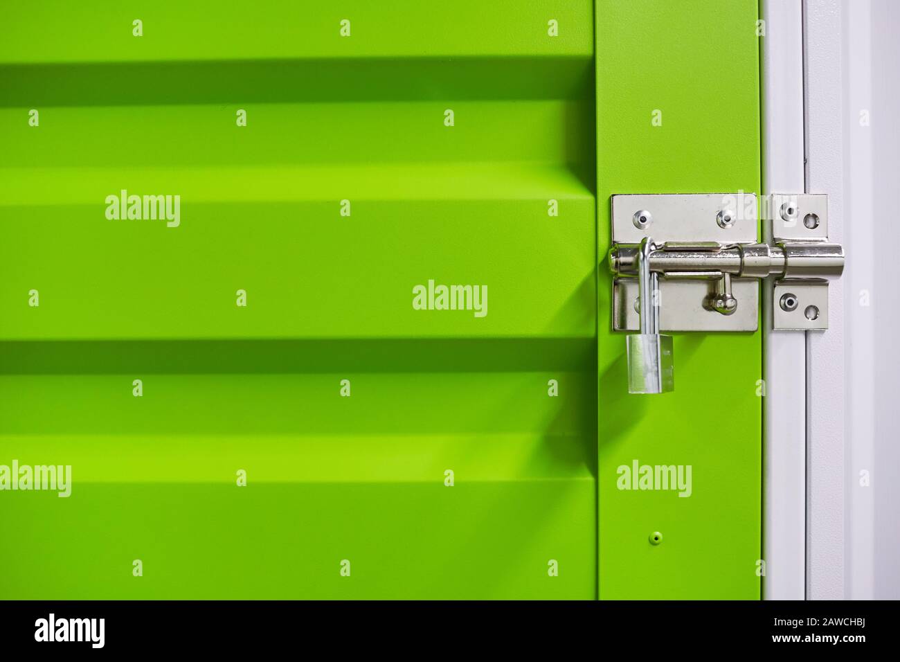 Close-up of closed green door of storage box in warehouse Stock Photo ...