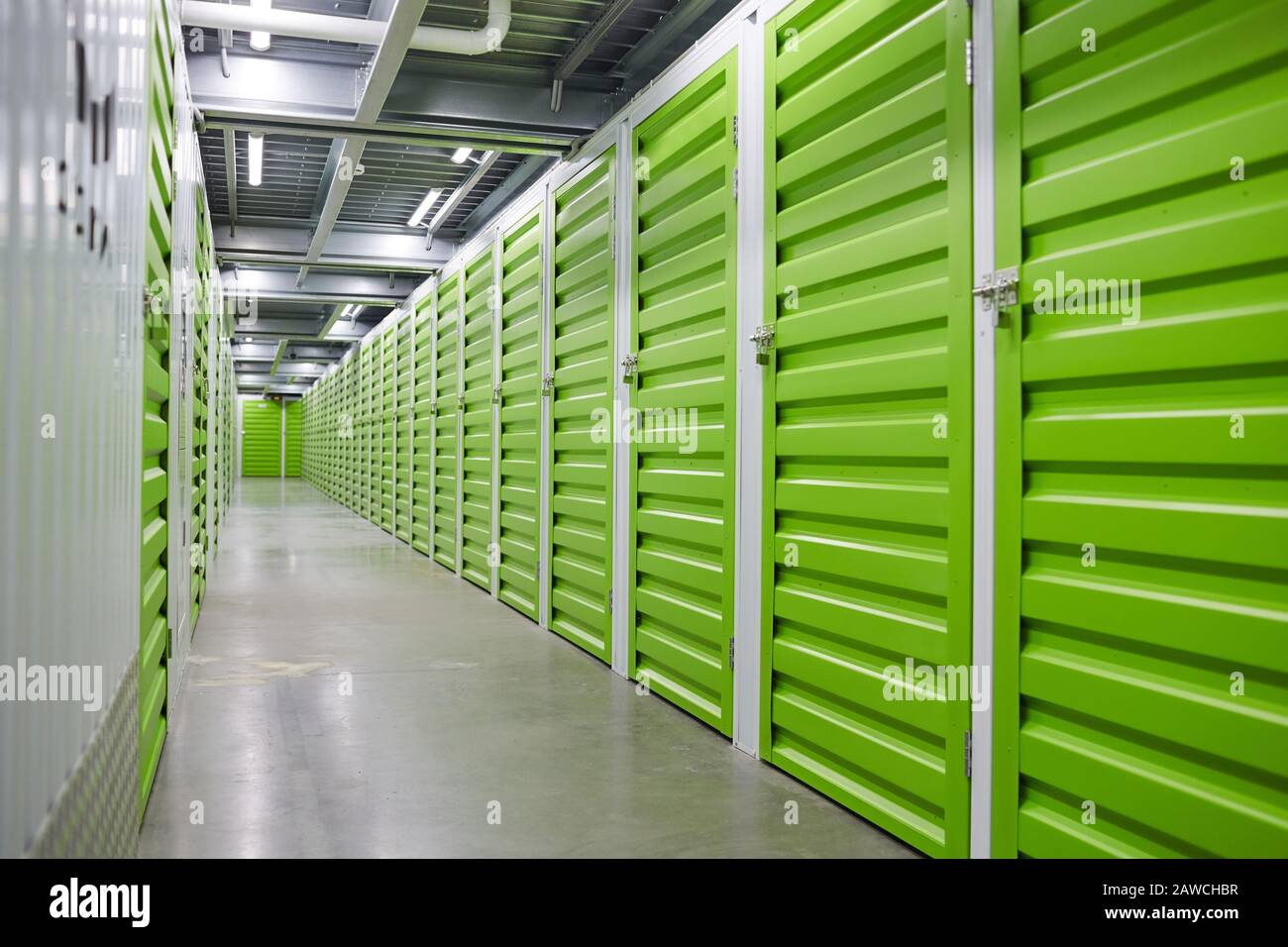 Image of modern warehouse with green storage boxes for storage Stock ...