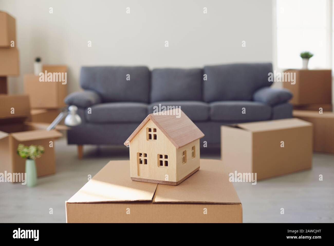 Model of the house on the floor in the new bright sunny house Stock ...