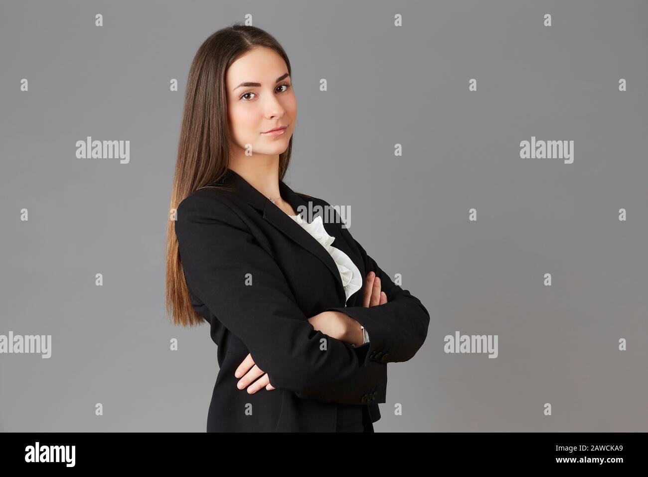 young businesswoman posing instudio background Stock Photo - Alamy