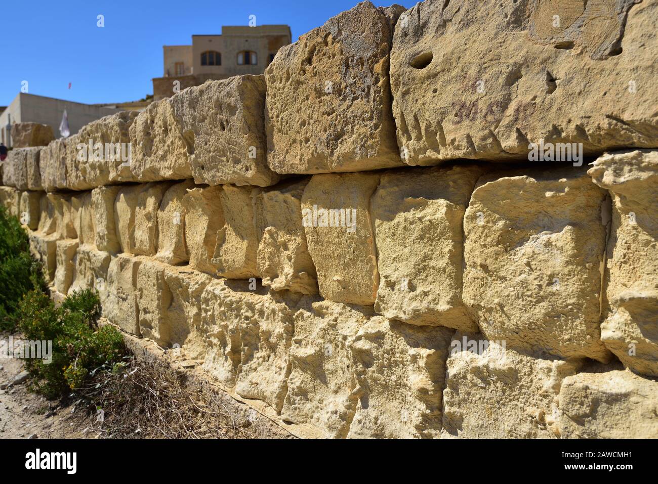 Stone built wall showing erosion Stock Photo - Alamy