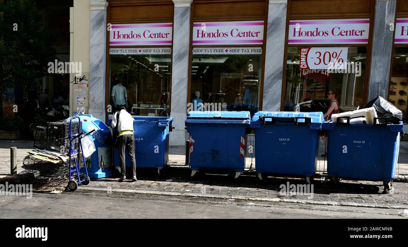 Athens, Greece - 7th July 2018:Man rummaging in the waste bins Stock ...
