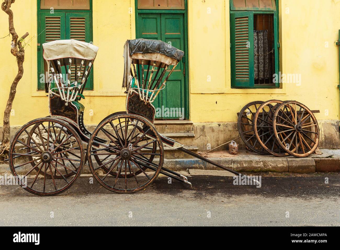 Hand pulled rickshaws are parkedon the street. Kolkata. India Stock ...