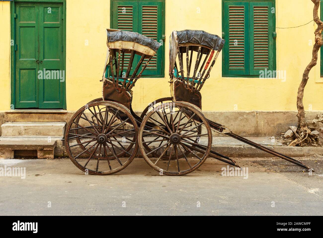 Hand pulled rickshaws are parkedon the street. Kolkata. India Stock ...