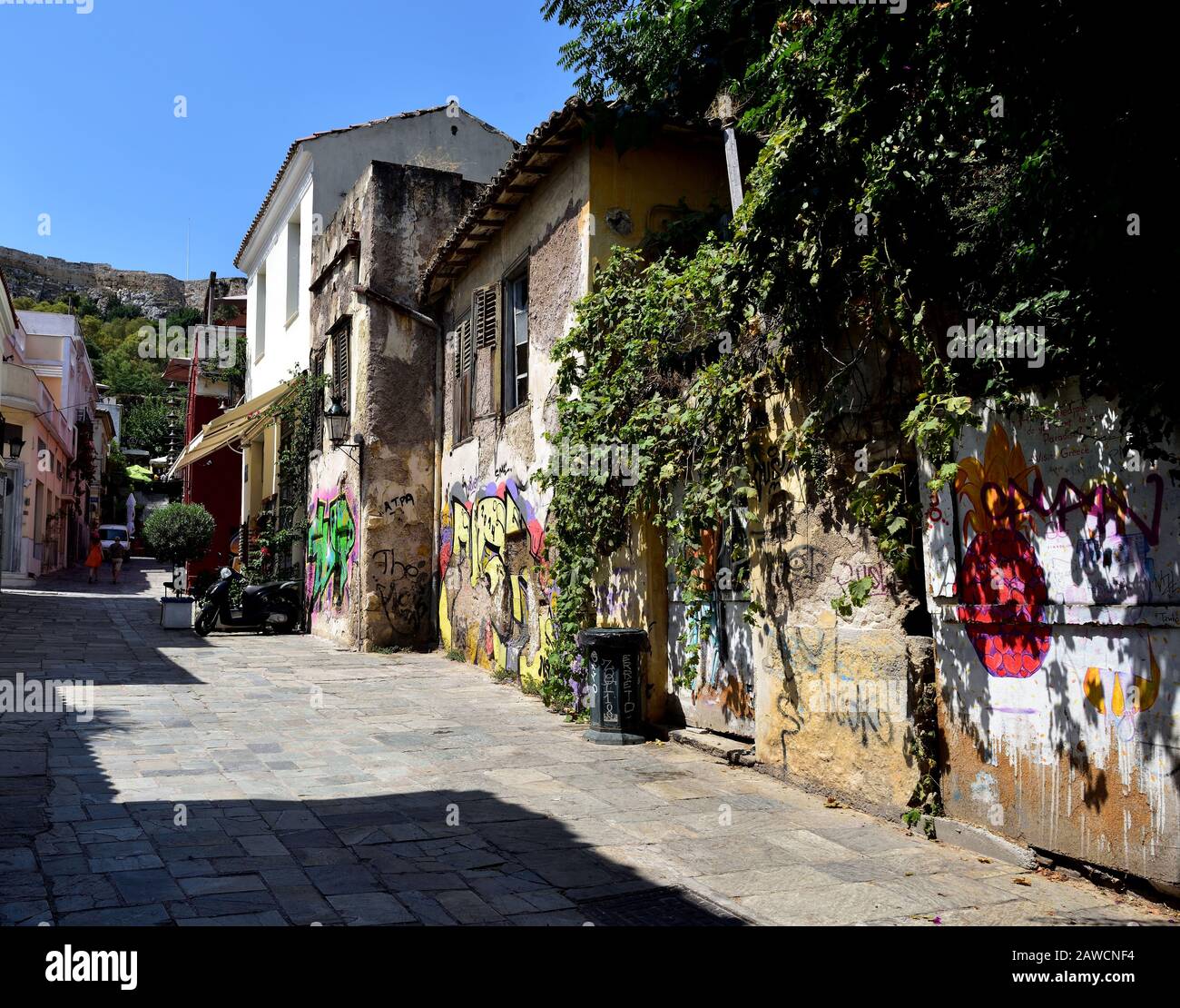 Athens, Greece - 7th July 2018:Sunshine on a quiet stree below the ...