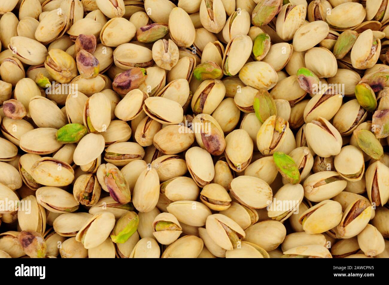 Roasted salted pistachio nut in shells background Stock Photo - Alamy