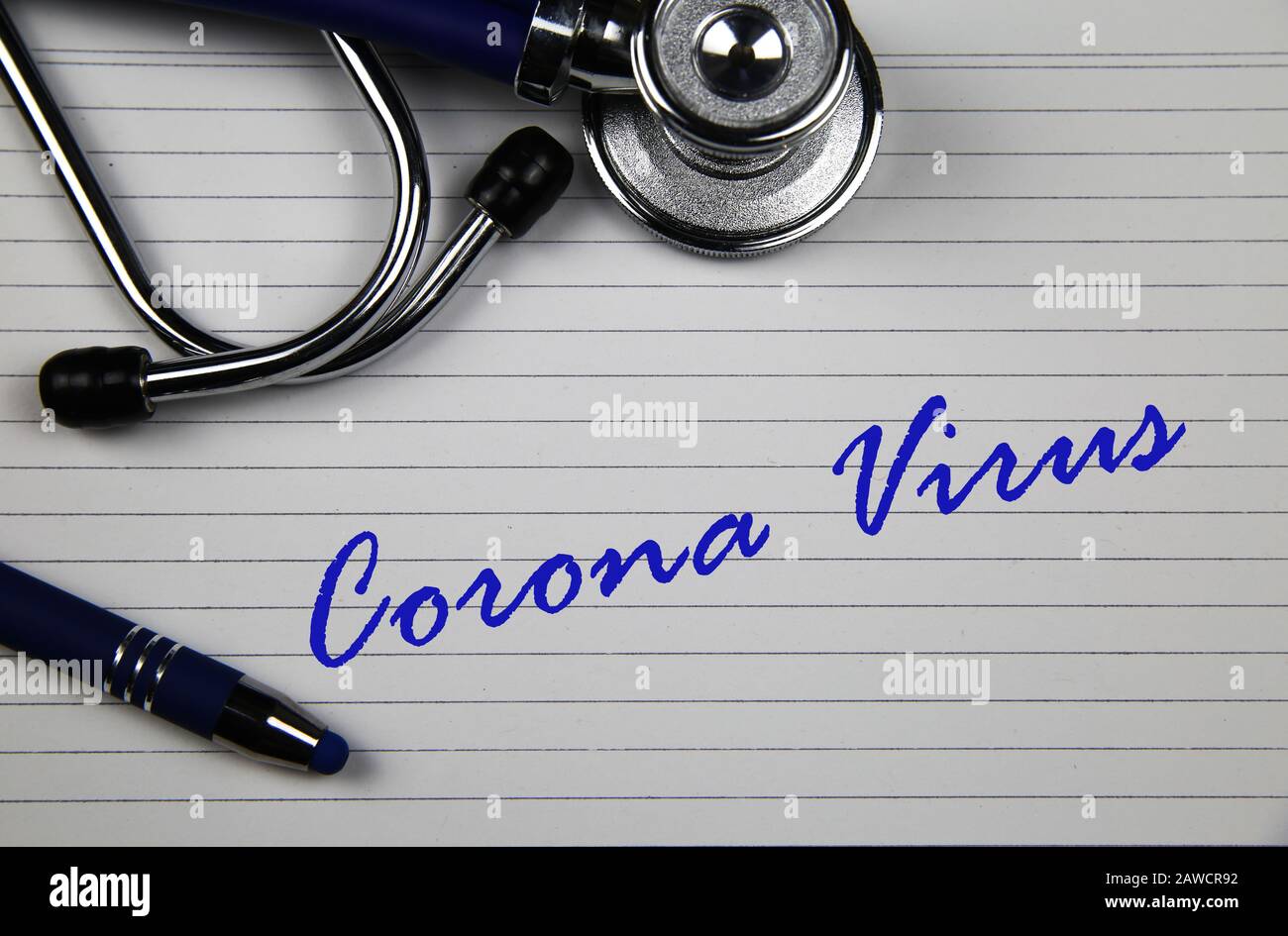 View on white index card with stethoscope and blue ball pen with words ...