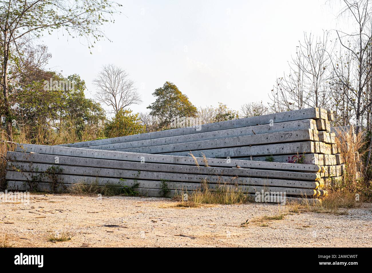 Stacked concrete electric pole on the ground prepare to use Stock Photo ...
