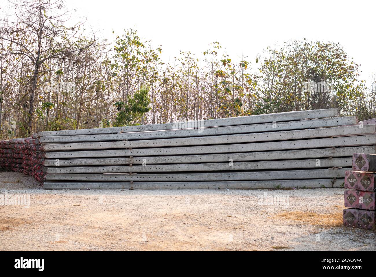 Stacked concrete electric pole on the ground prepare to use Stock Photo ...