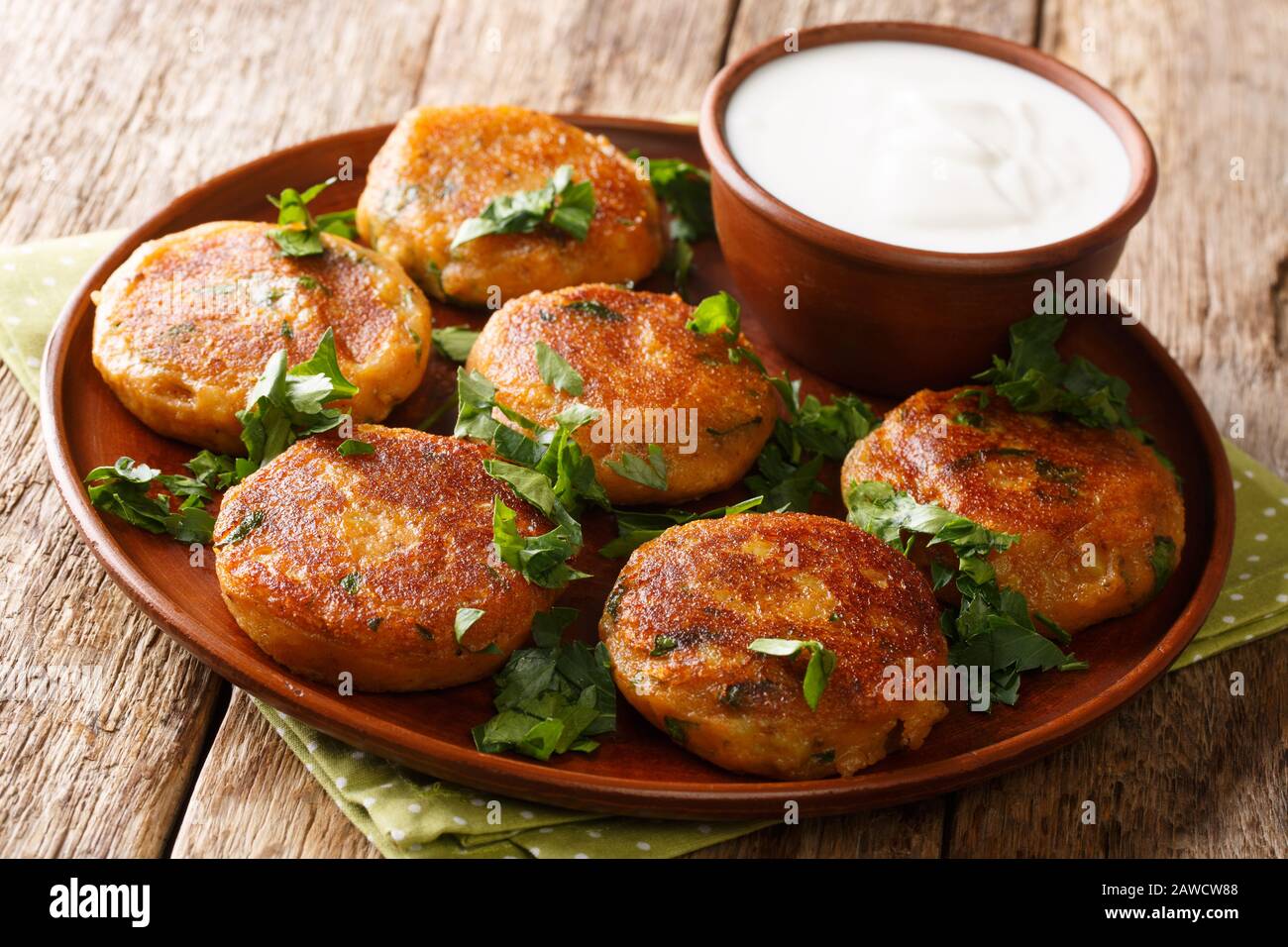 Fried potato patties Aloo Tikki with indian spices served with yogurt ...