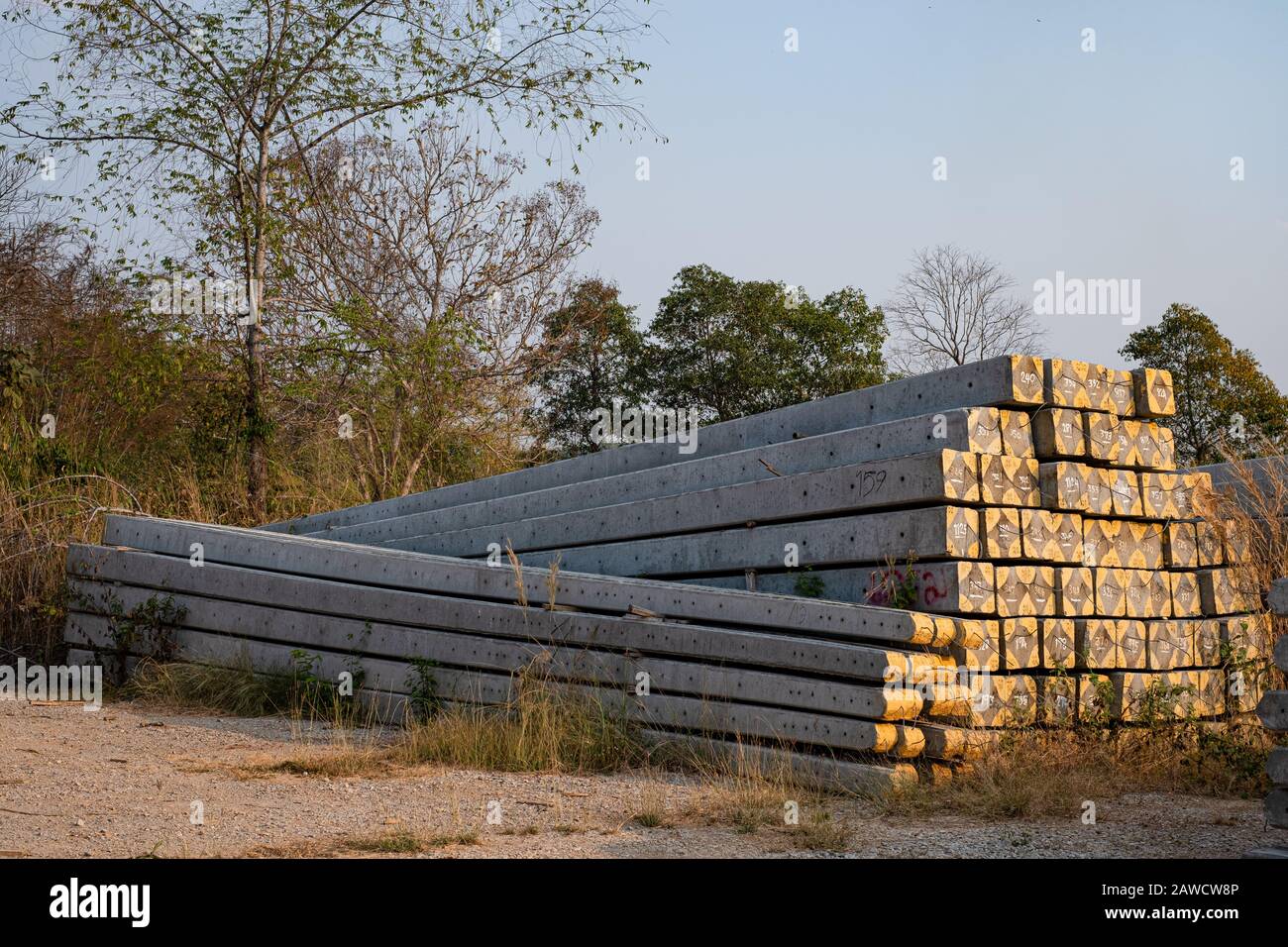 Stacked concrete electric pole on the ground prepare to use Stock Photo ...