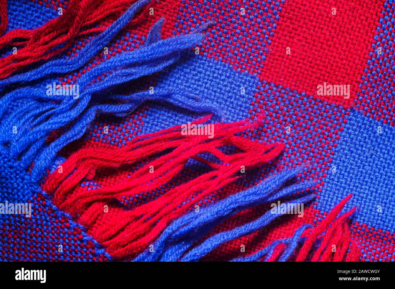 Blue and red checked scarf with fringe as background Stock Photo - Alamy