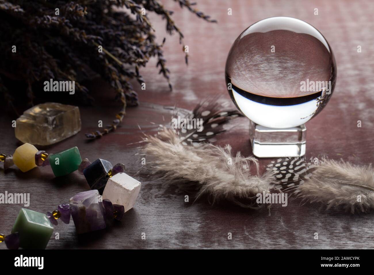 Divination with lavender, stones, feathers, fortune-telling ball ...