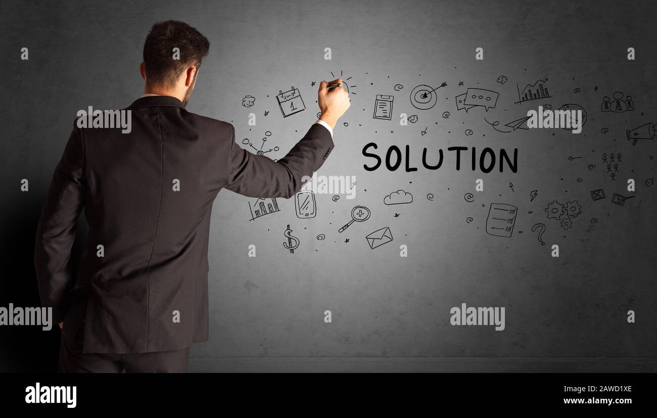 businessman drawing a creative idea sketch with SOLUTION inscription ...