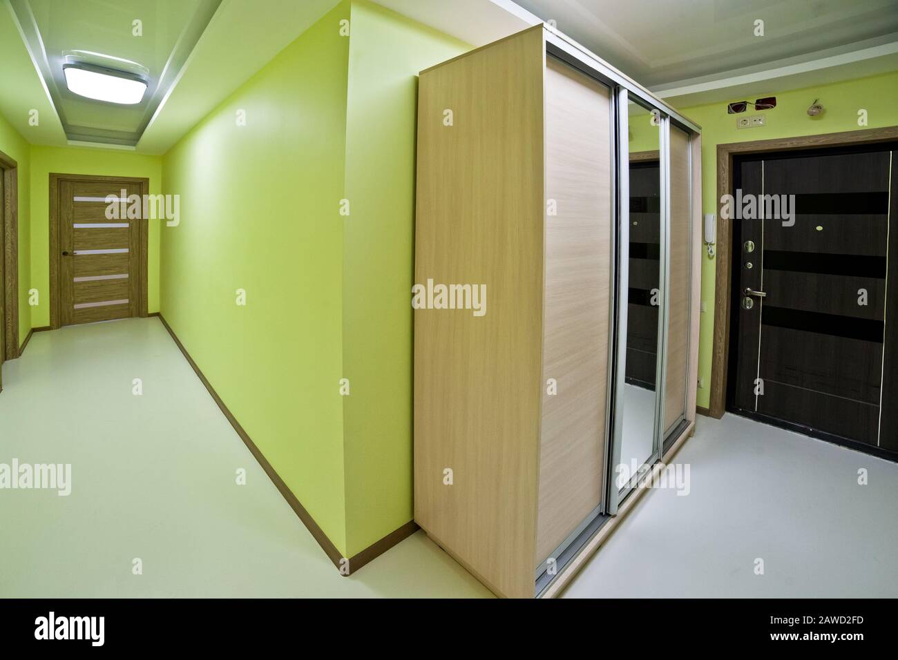 interior of a modern light corridor with green walls and modern ...