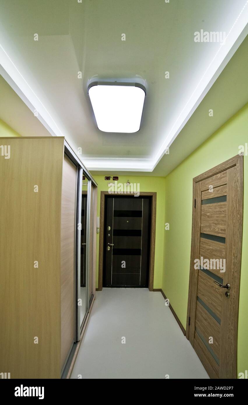 interior of a modern light corridor with green walls and modern ...