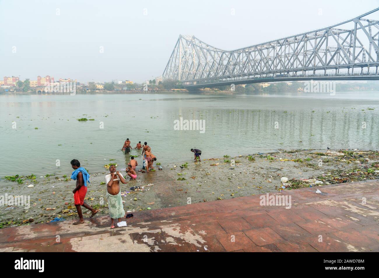 Indian people bathing in river Hooghly or Ganga at Mallick ghat in ...
