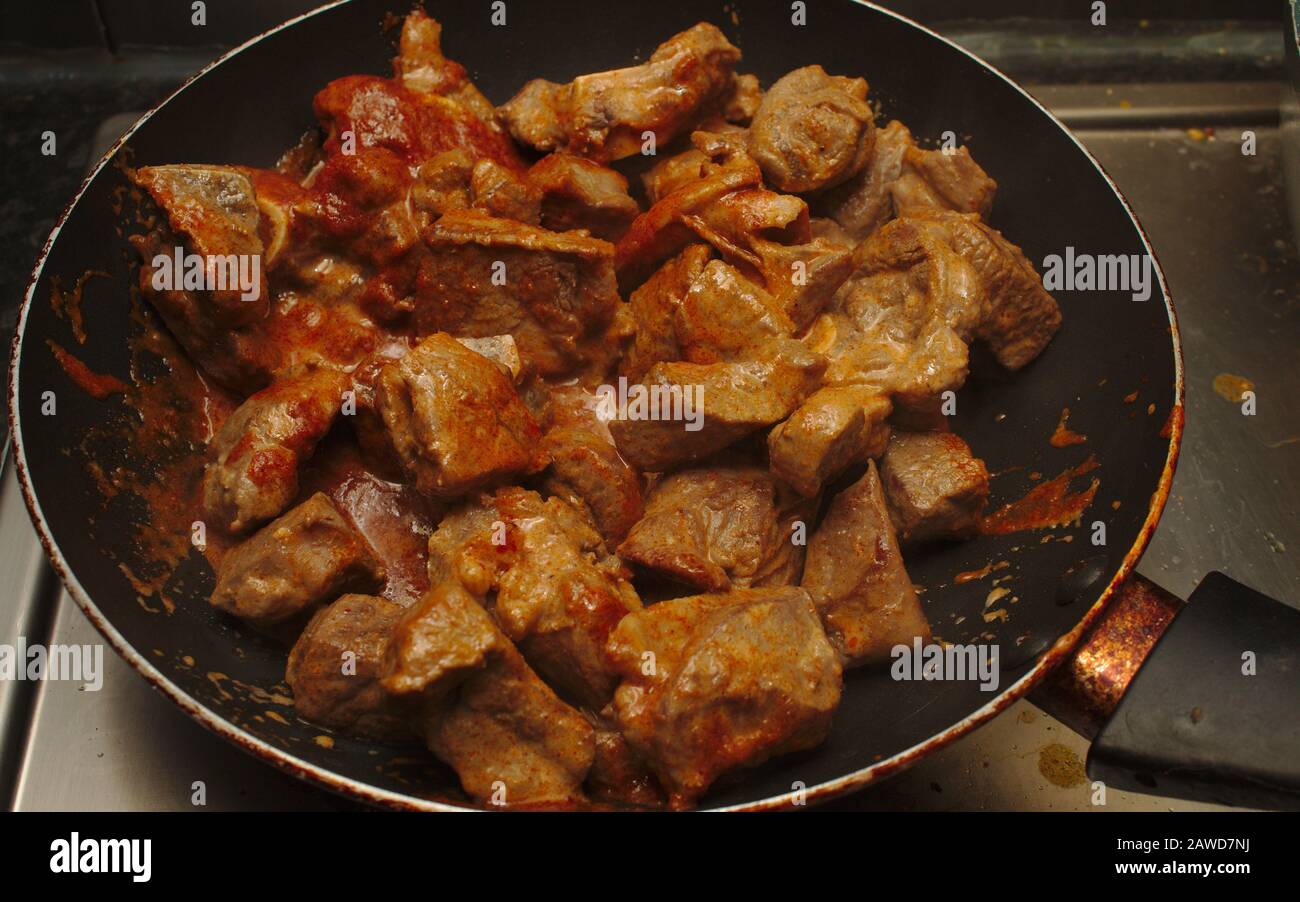 Mutton curry cooking Stock Photo - Alamy